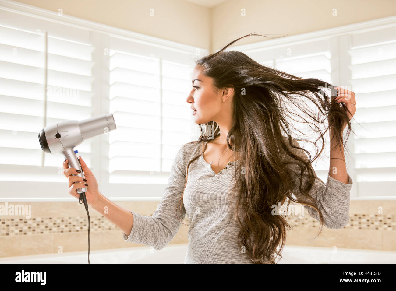 Women drying their hair hi-res stock photography and images - Alamy