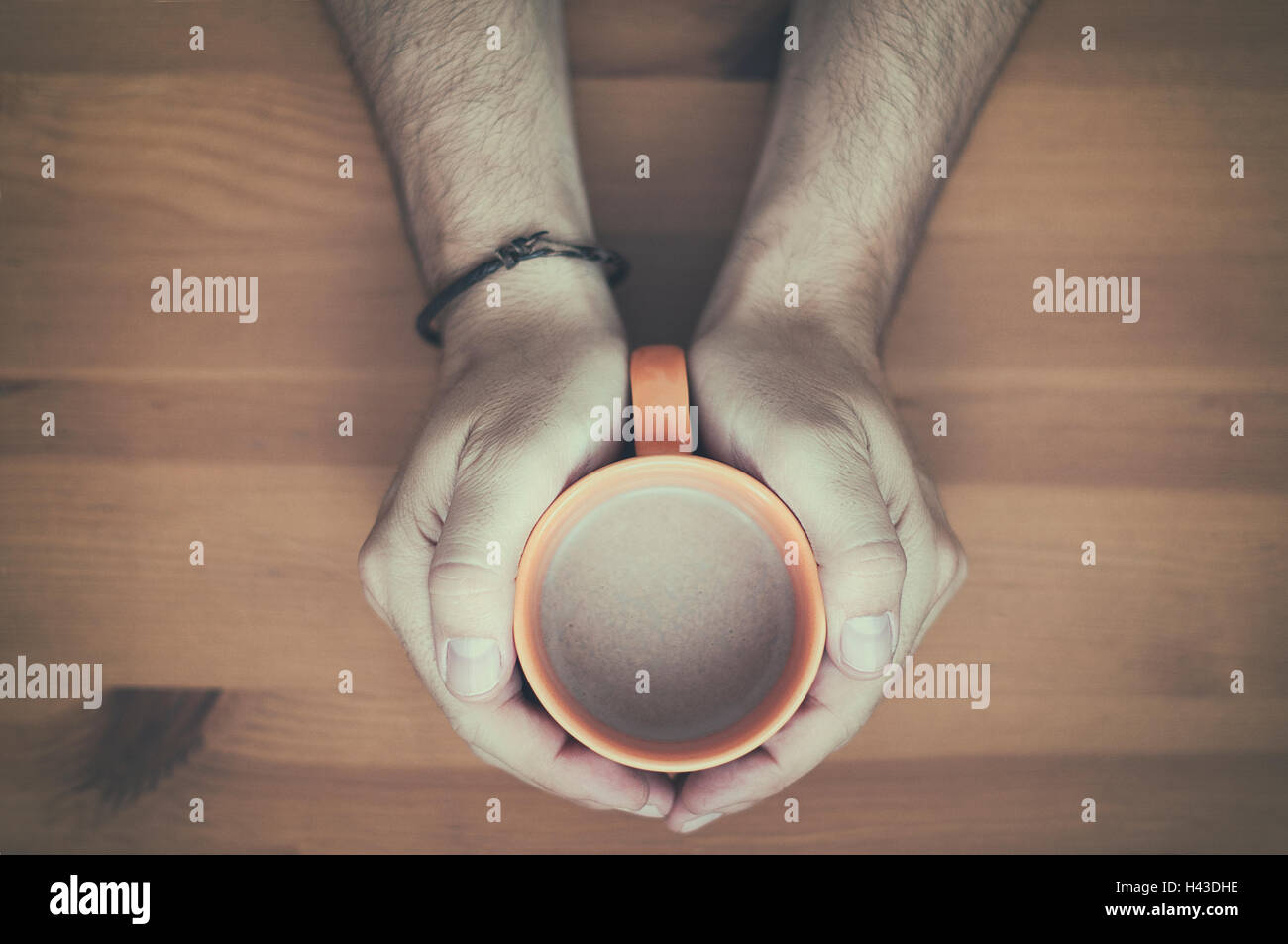 Man holding a cup of tea Stock Photo - Alamy