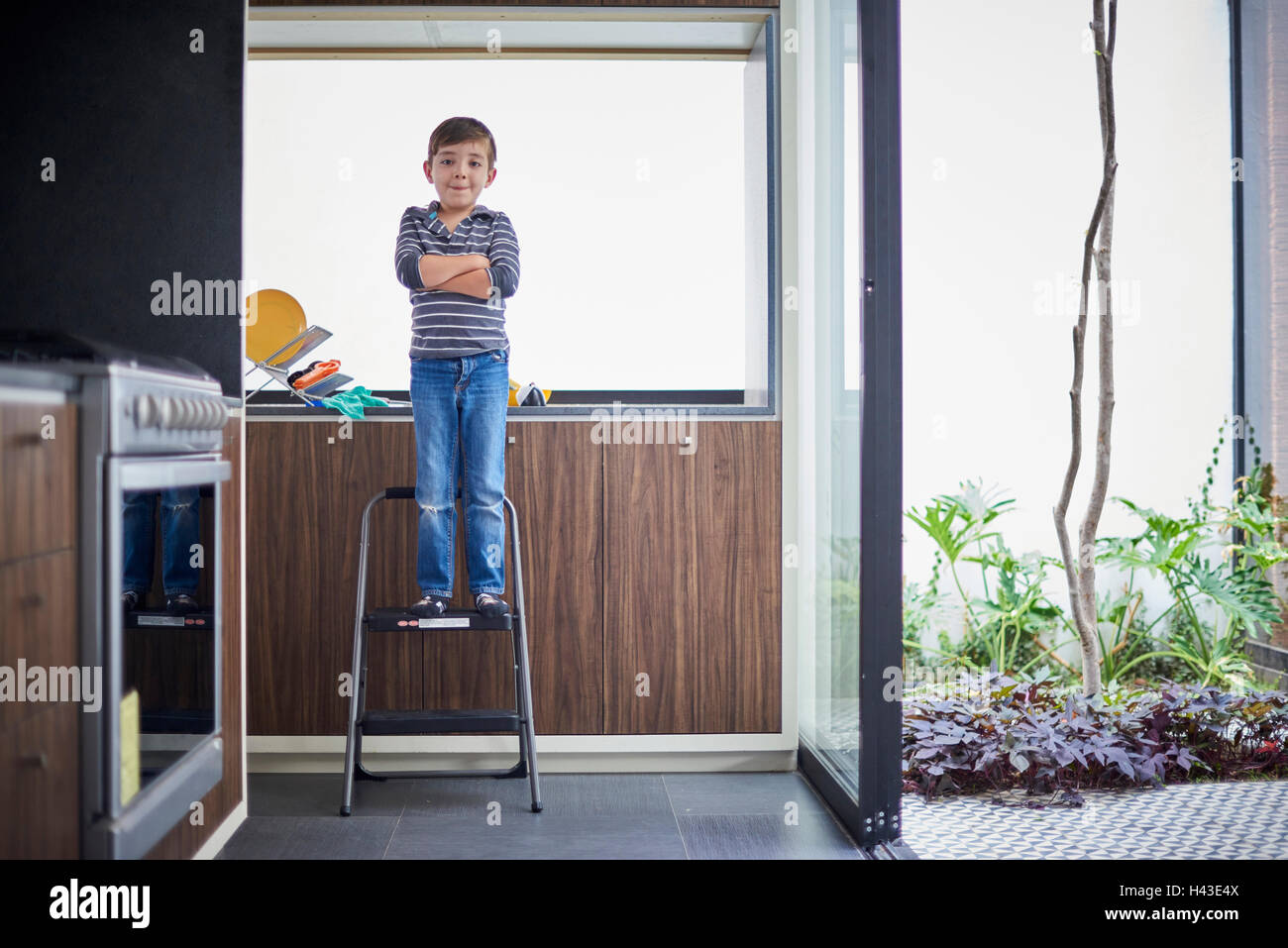Boy on the ladder hi-res stock photography and images - Alamy