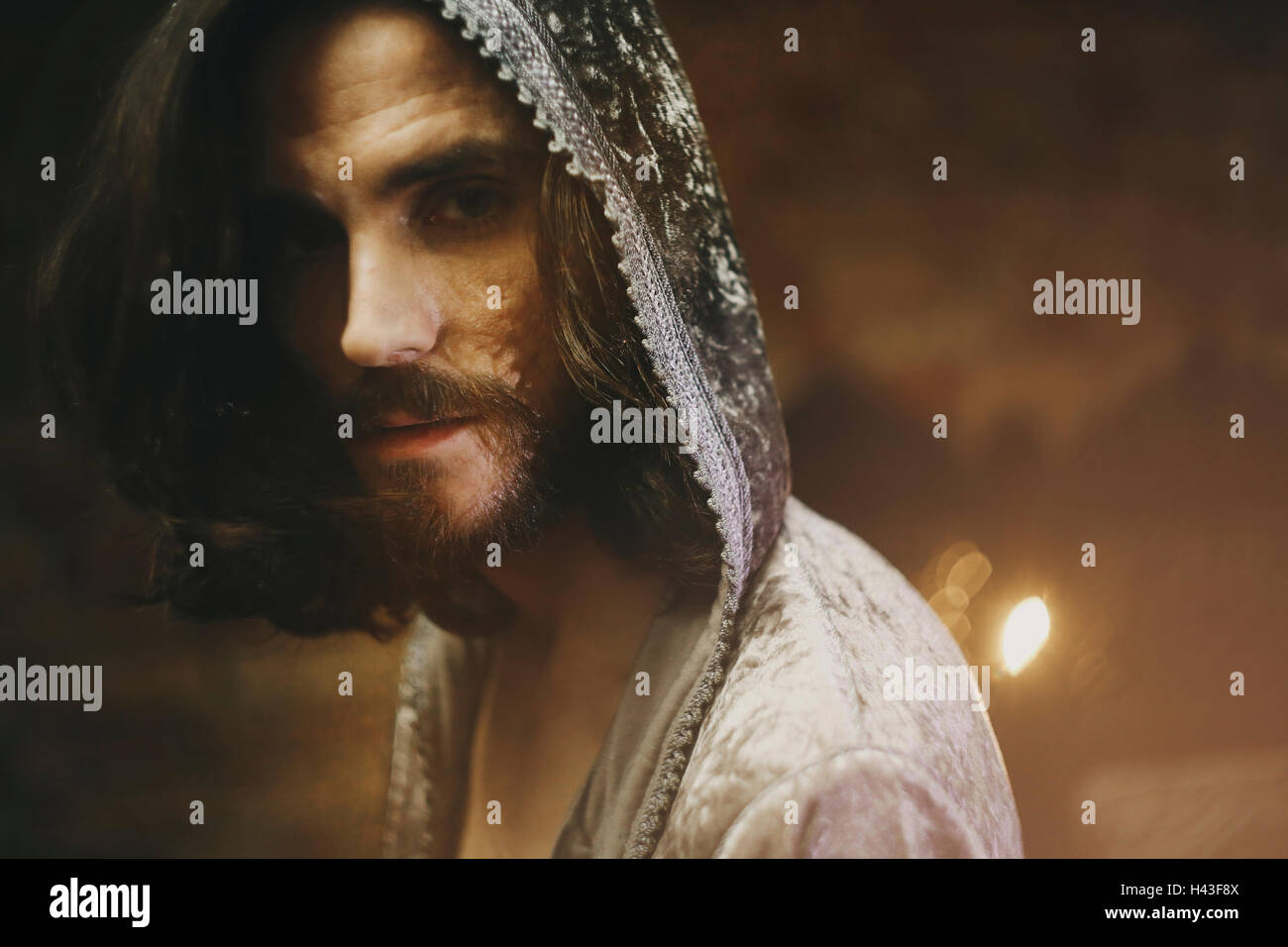 Caucasian man with beard wearing robe with hood Stock Photo - Alamy