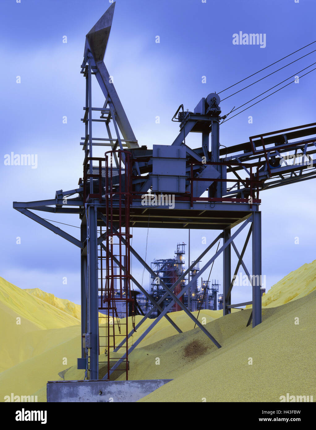 Machinery in piles of grain Stock Photo - Alamy
