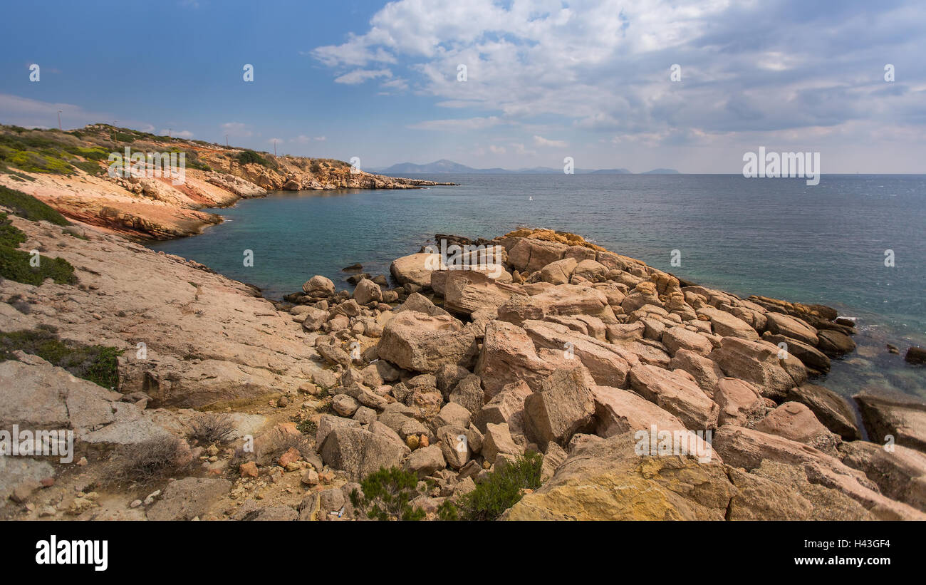 Rocky coast of the Aegean sea in Glyfada, Greece Stock Photo - Alamy