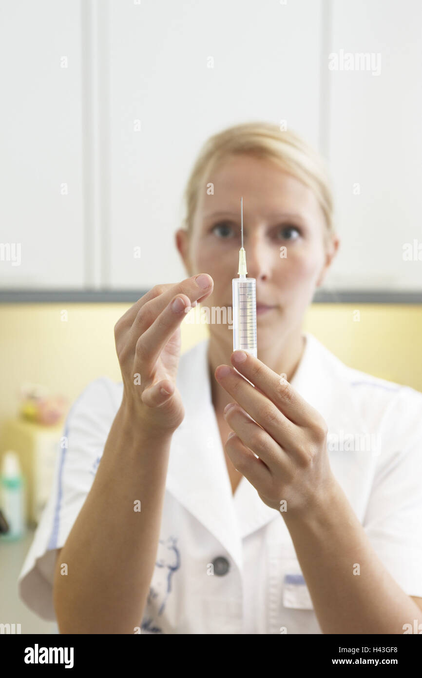 Doctor, gesture, syringe, gather, half portrait, curled, model released ...