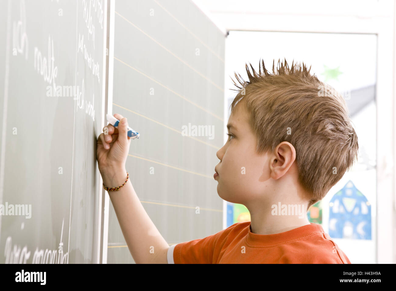 Classroom, schoolboy, blackboard, writing Stock Photo - Alamy