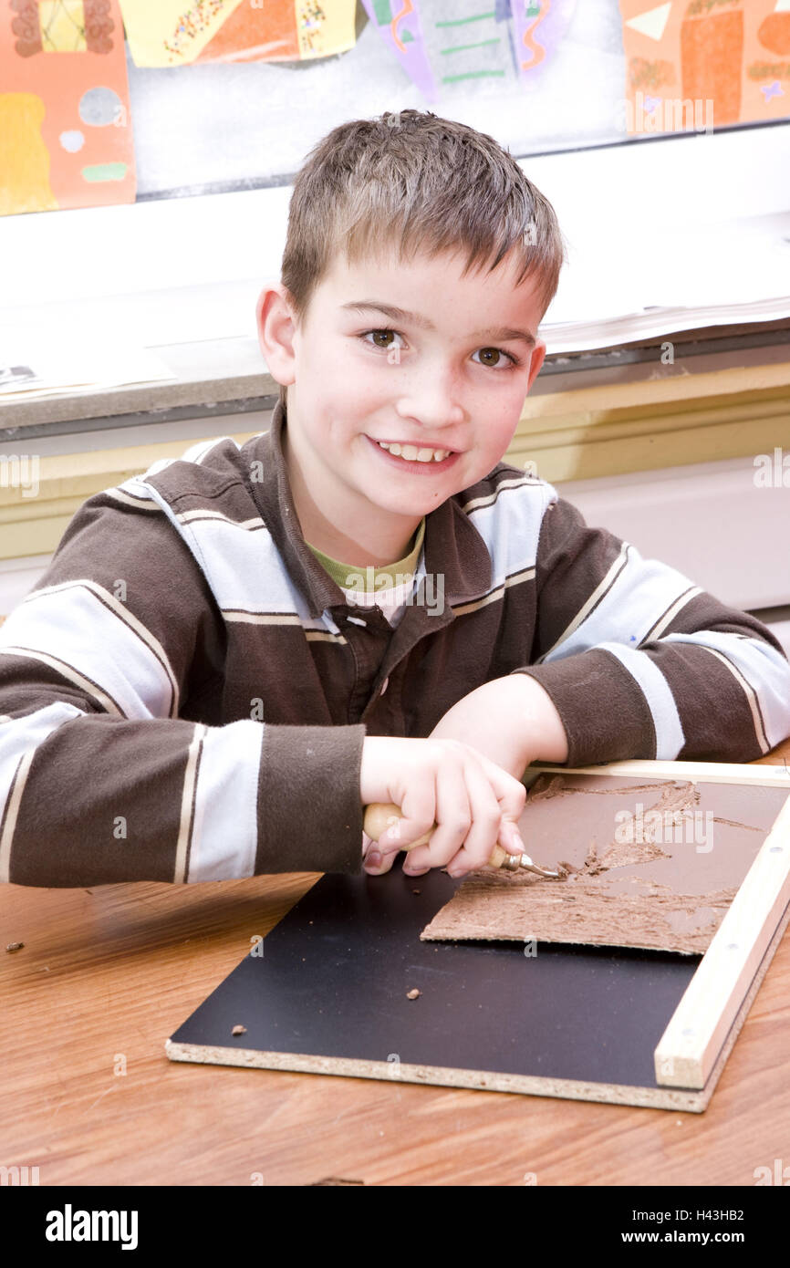 Classroom art lessons boy linocut hi-res stock photography and images ...