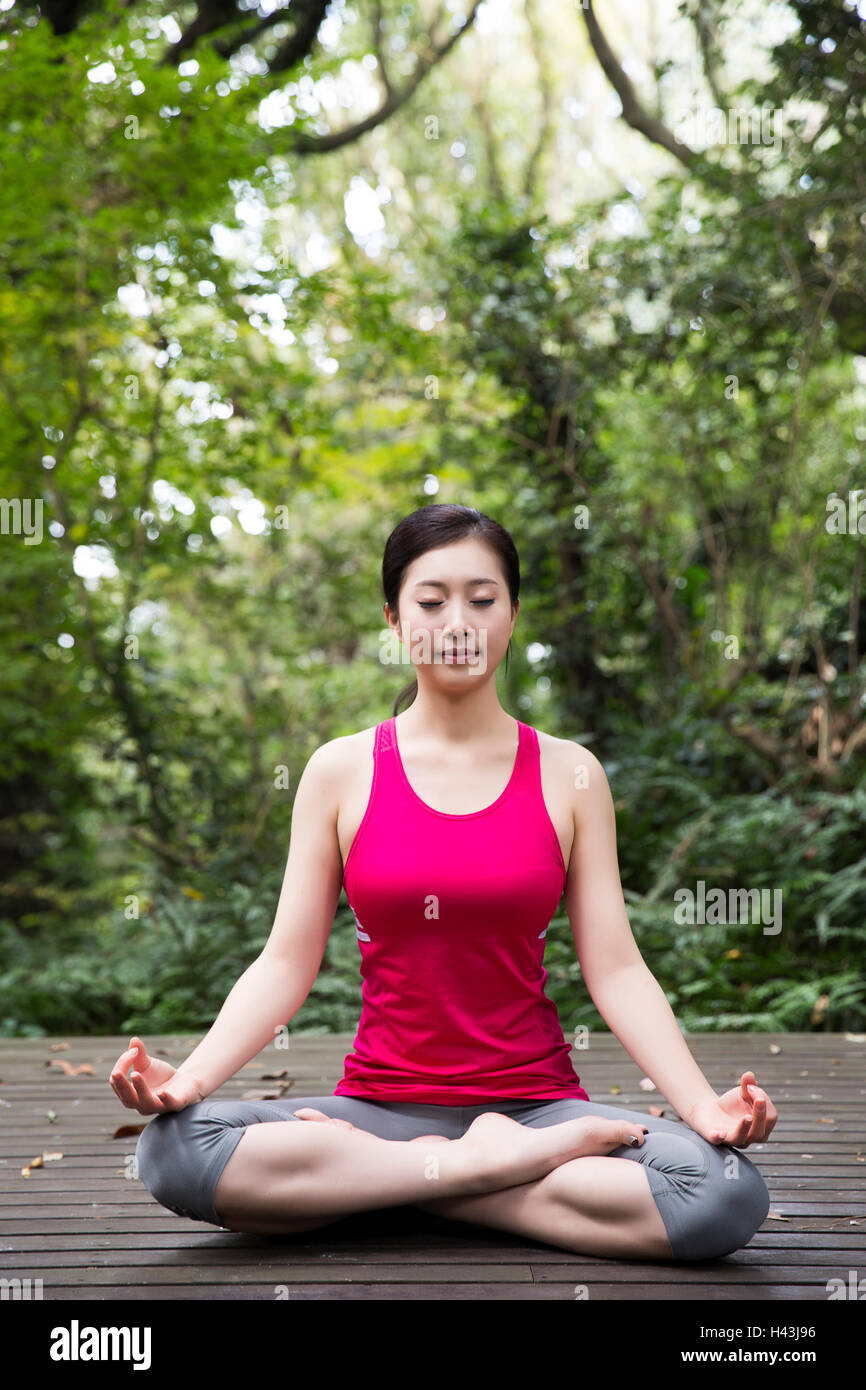 Portrait of Young Asian Woman Doing Yoga Pose Stock Photo - Alamy