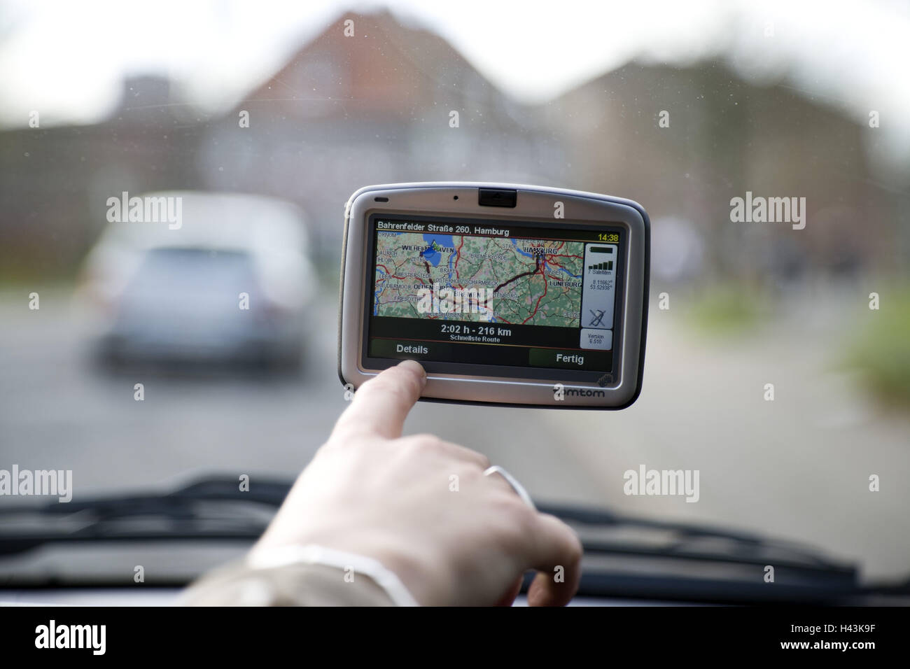 Navigation system in the car, women's hand, service Stock Photo - Alamy