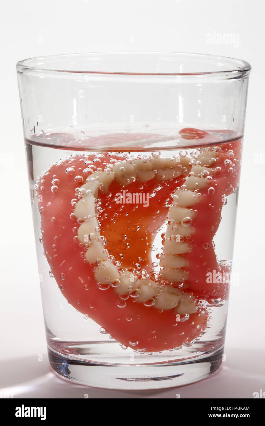 Bite prosthesis, water glass Stock Photo - Alamy