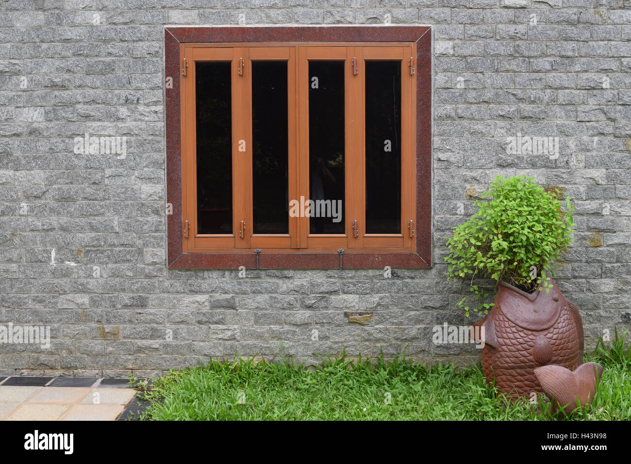 background of window and stone wall with pottery for ornamental plant ...