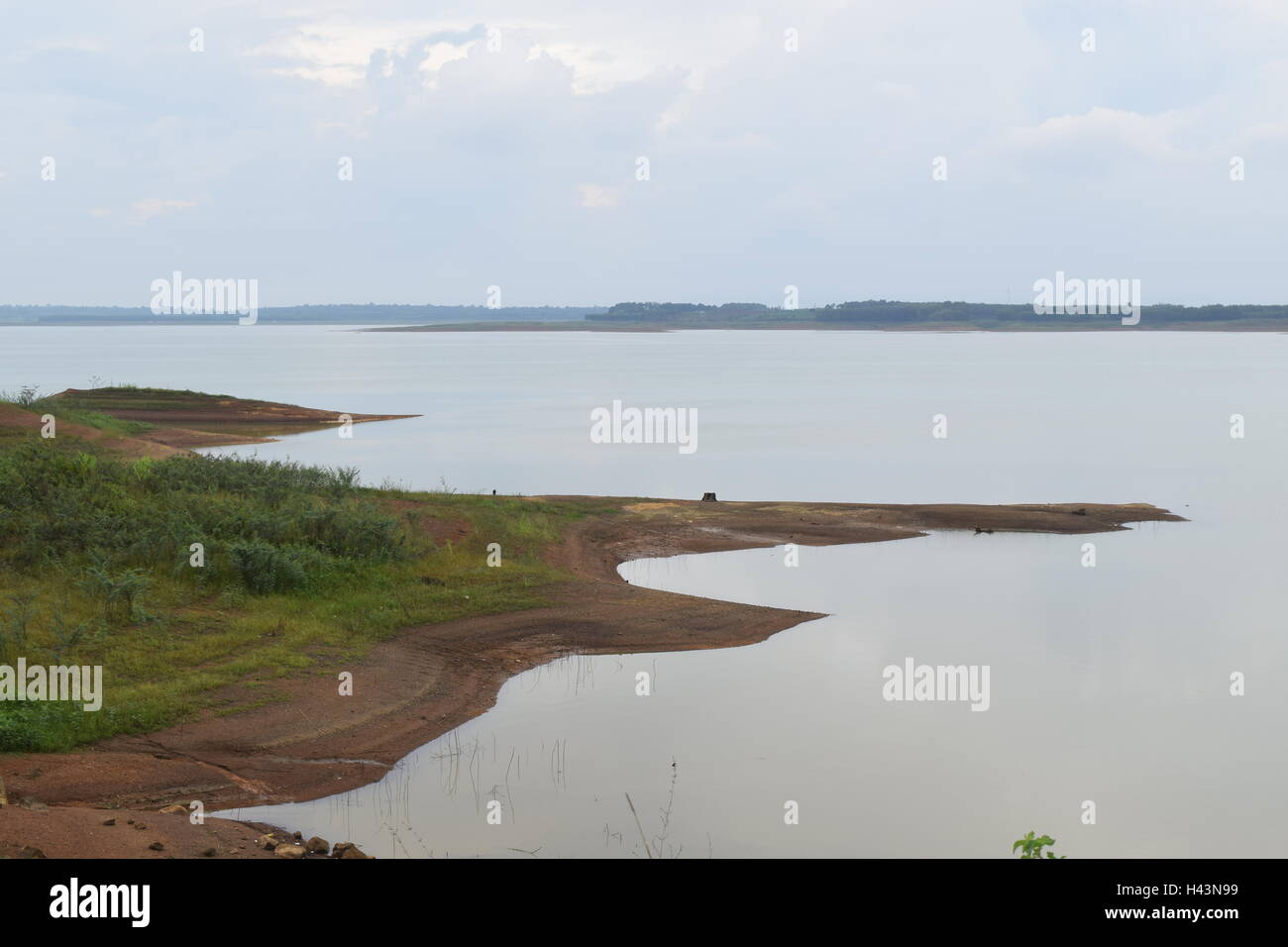 tropical river with alluvial bank and green meadow Stock Photo - Alamy