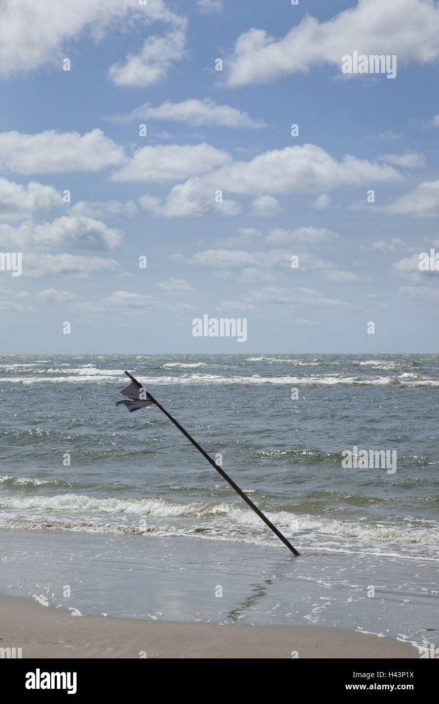 Sea, beach, flag, wind Stock Photo - Alamy