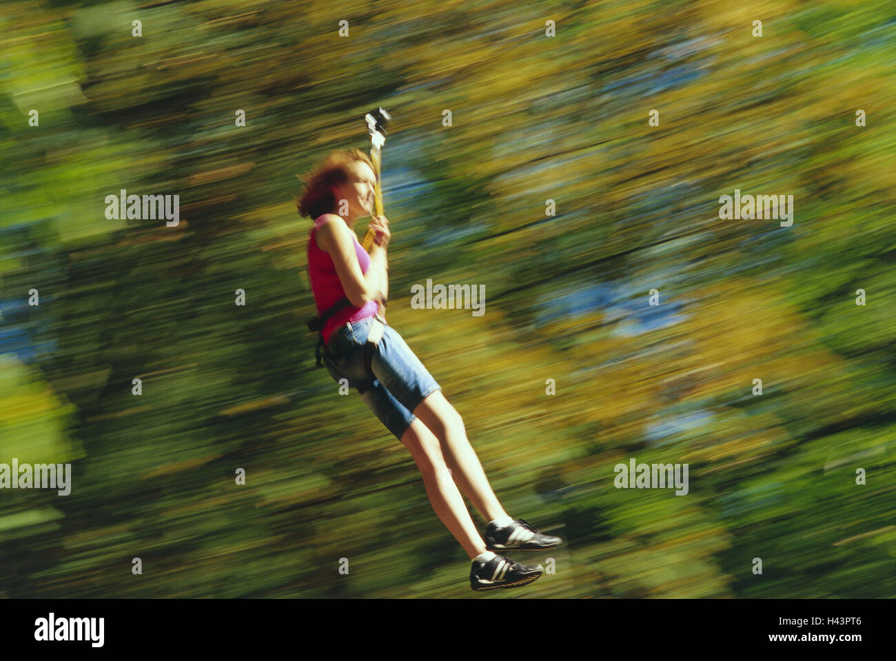 High rope garden, woman, rope children's slide, side view, blur, person ...
