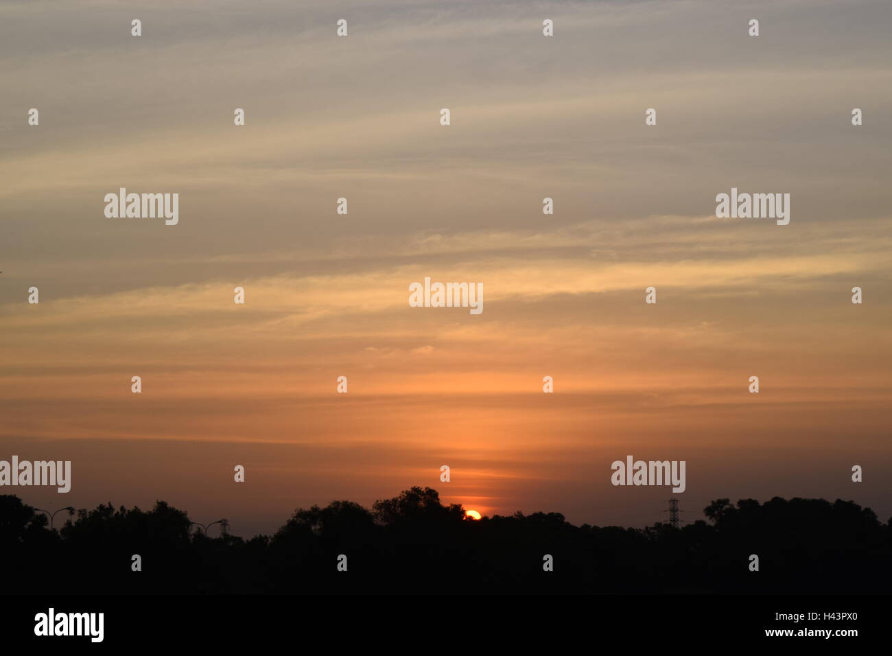 sunset sky with the sun behind the scence Stock Photo - Alamy