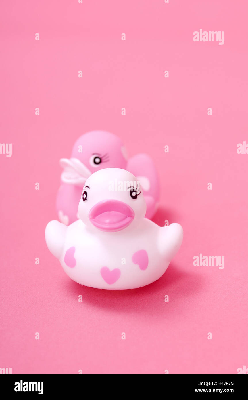 two bath ducks, pink background Stock Photo - Alamy
