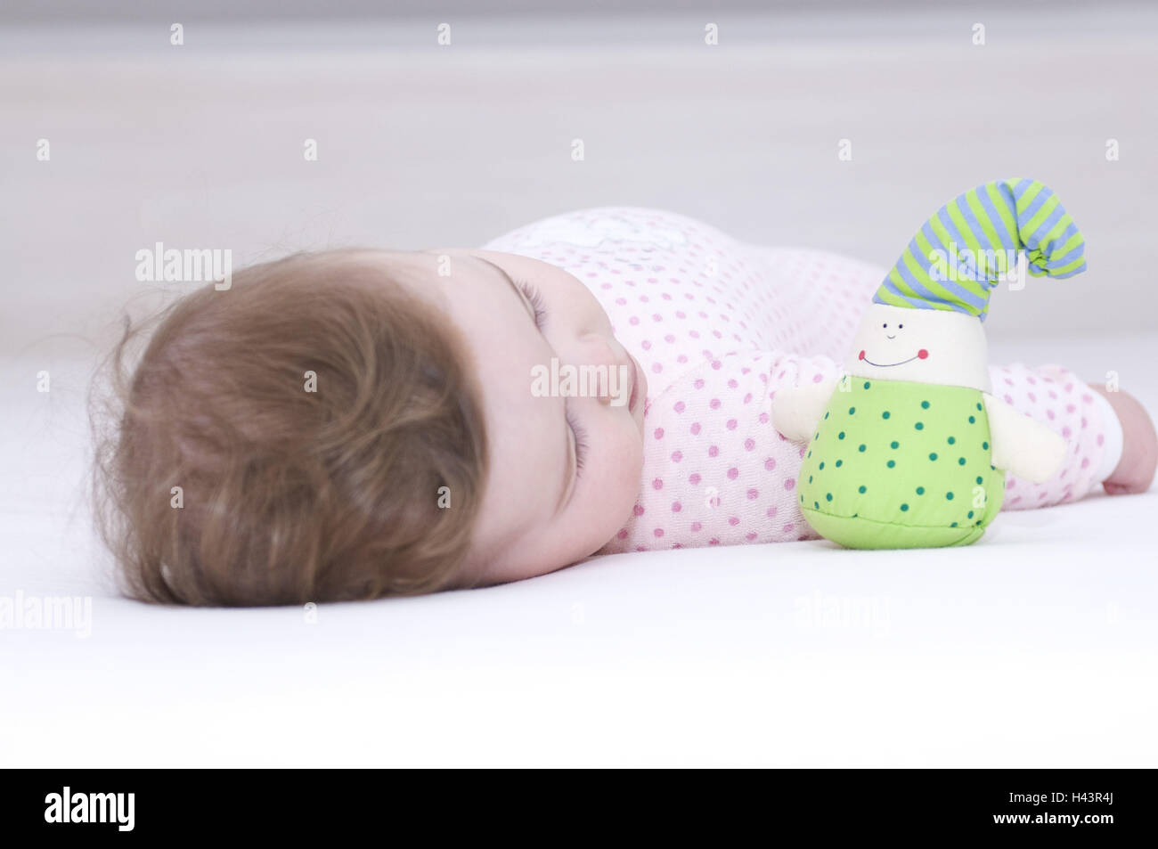 Baby, back position, toys, look Stock Photo - Alamy