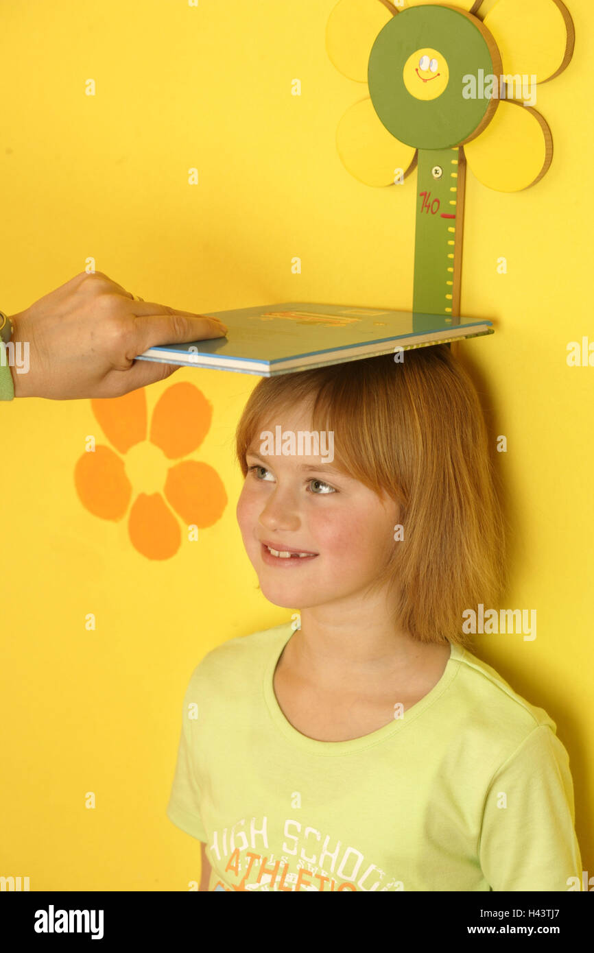 Girls, measuring pole, body height, portrait, book Stock Photo - Alamy