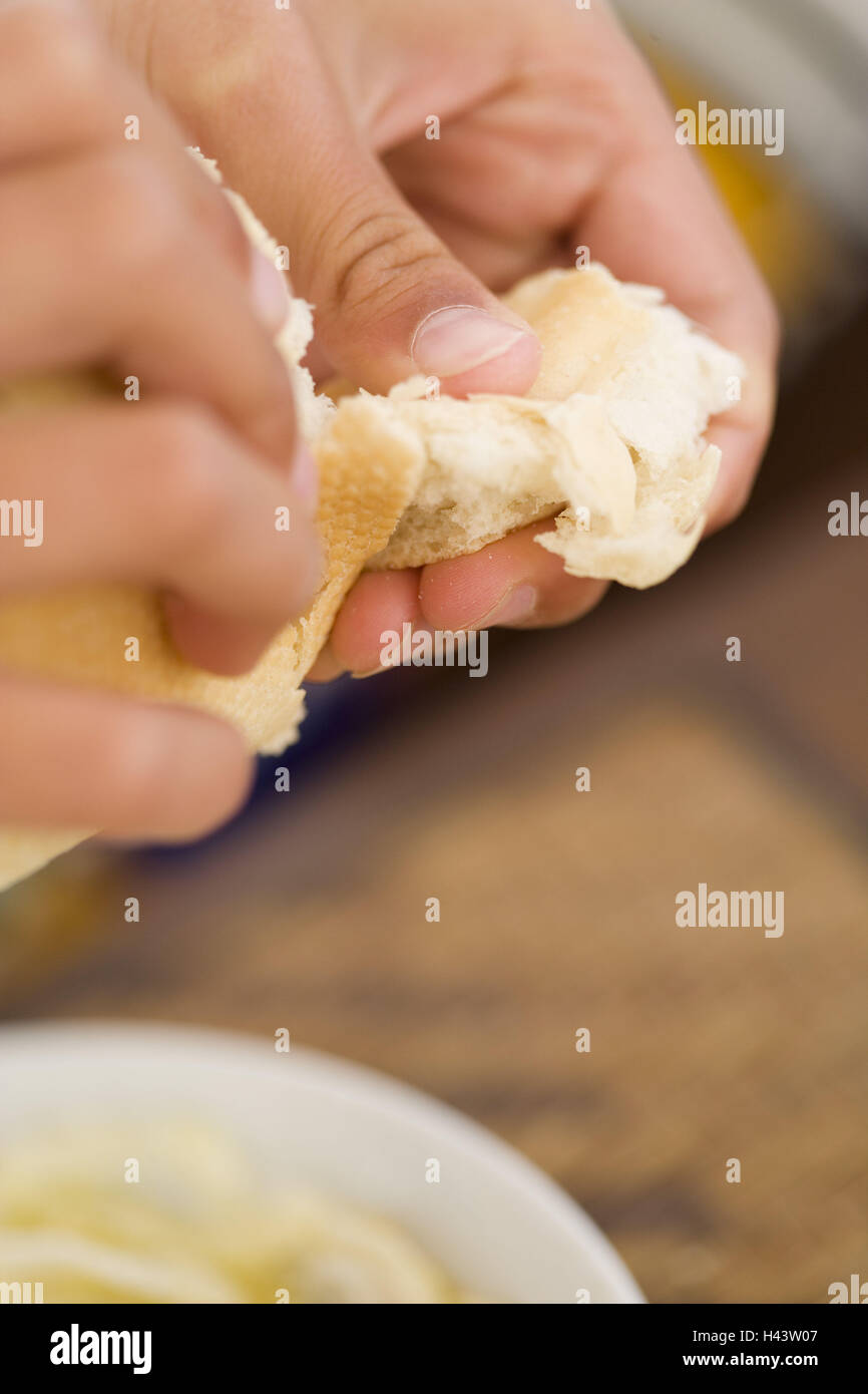 Hands, white bread, medium close-up Stock Photo - Alamy
