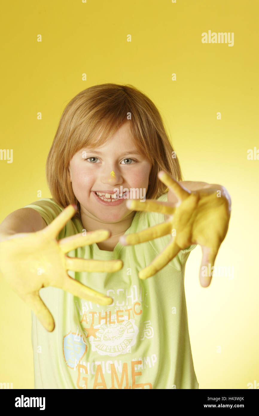 Girl, hands, yellow, paints, half portrait Stock Photo - Alamy