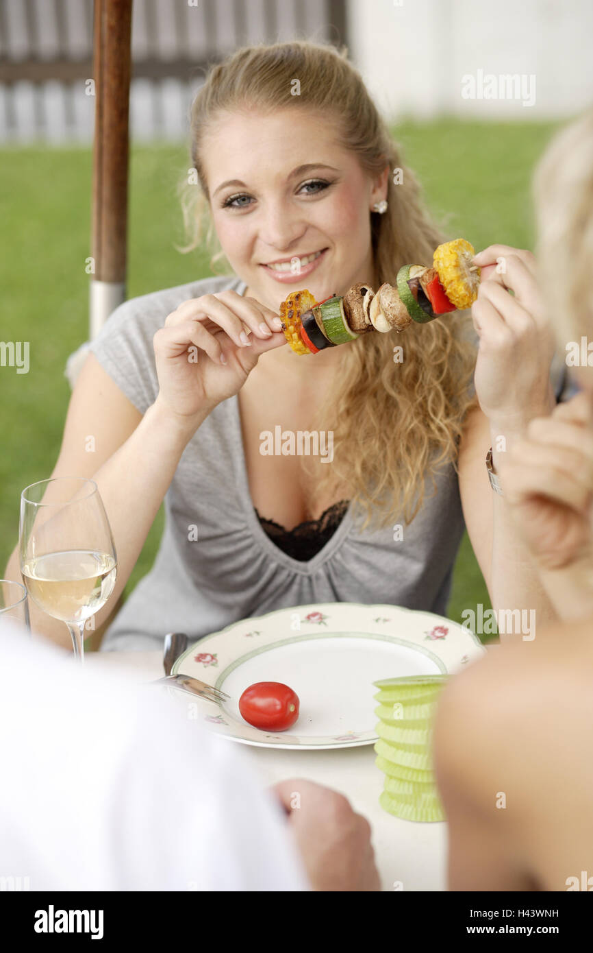 Grill party, woman, smile, hold vegetable spit, portrait Stock Photo ...