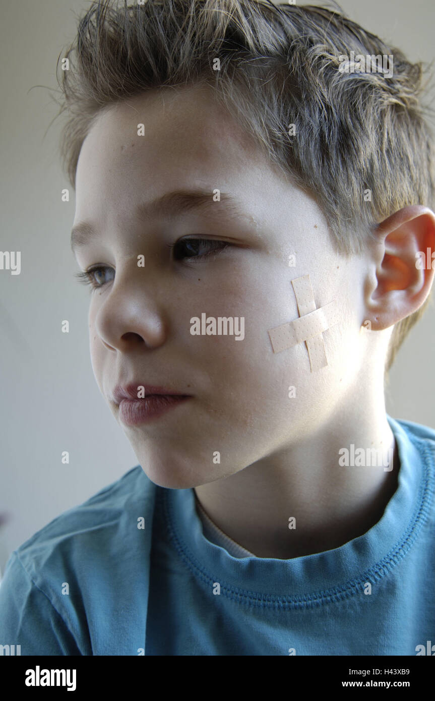 Boy sadly cheek plaster portrait hi-res stock photography and images ...