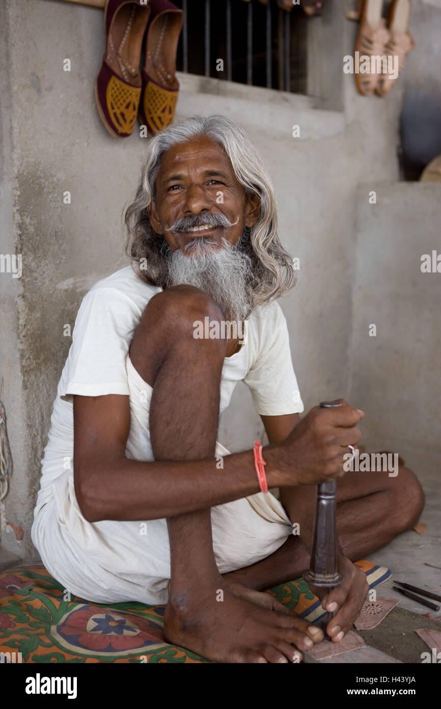 India, Rajasthan, Luni, shoemaker, smile, leather, punch Stock Photo ...