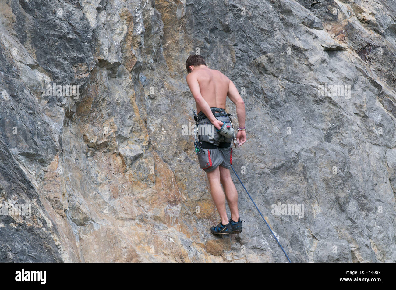 Rock, climber, back view Stock Photo - Alamy