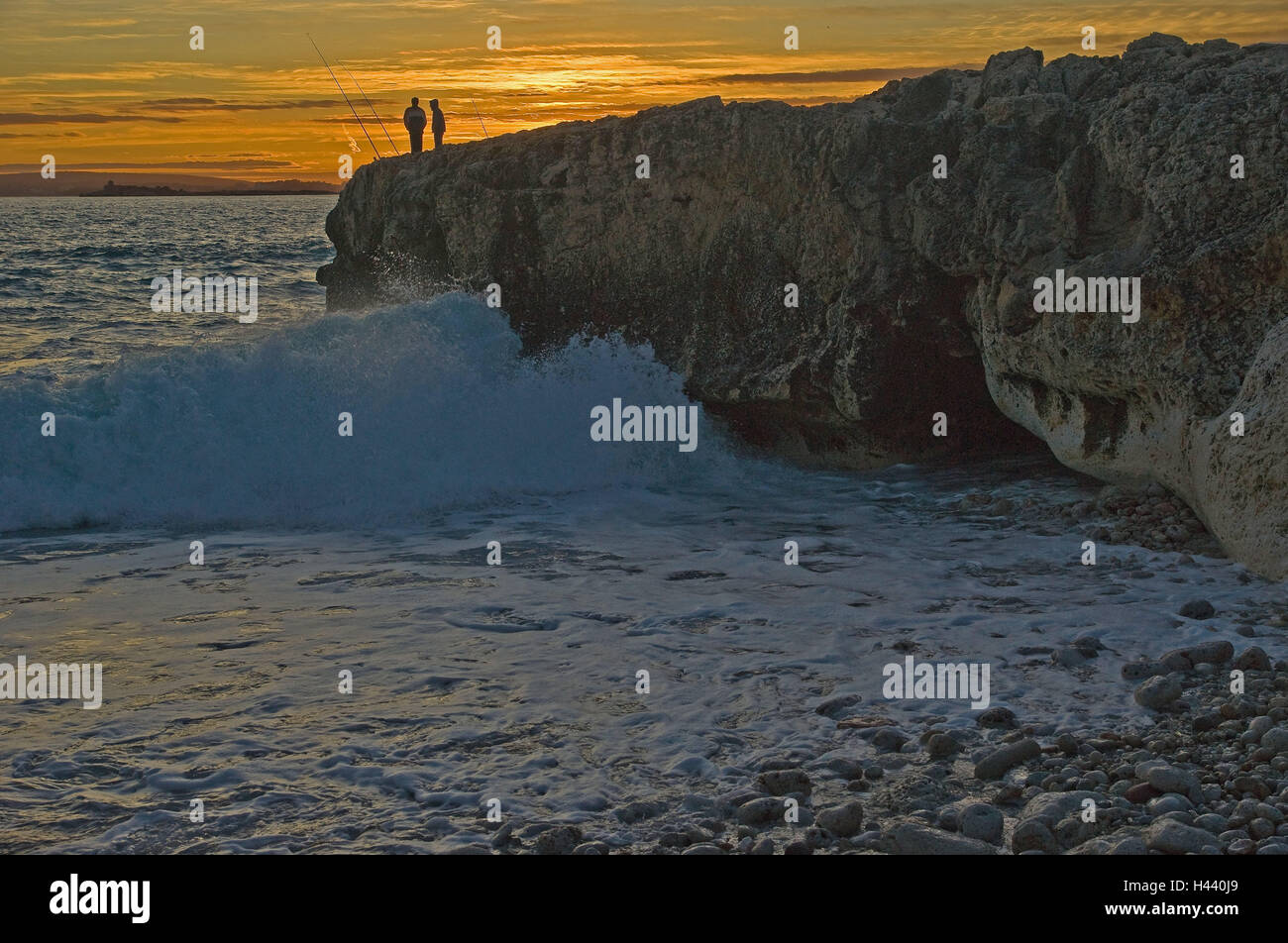 Spain, Majorca, Platja de Cala Major, steep coast, angler, sunset Stock ...