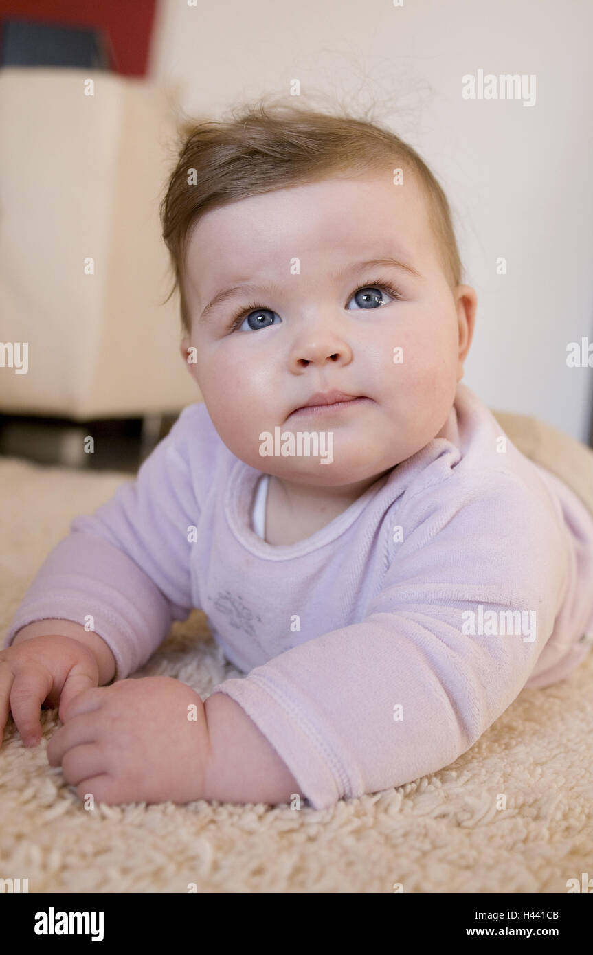 Baby, carpet, lie, portrait Stock Photo - Alamy