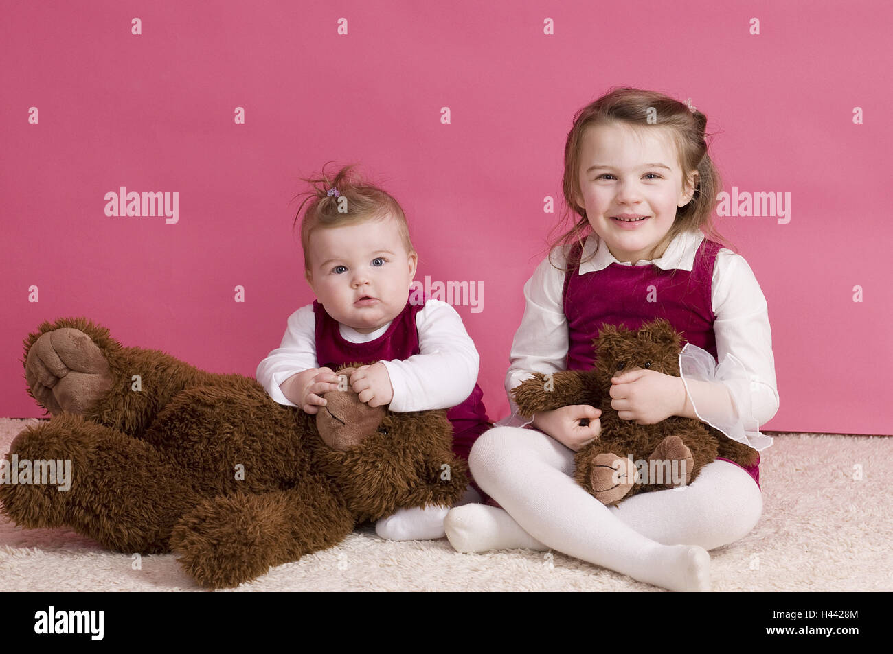 Children with teddy bear Stock Photo - Alamy