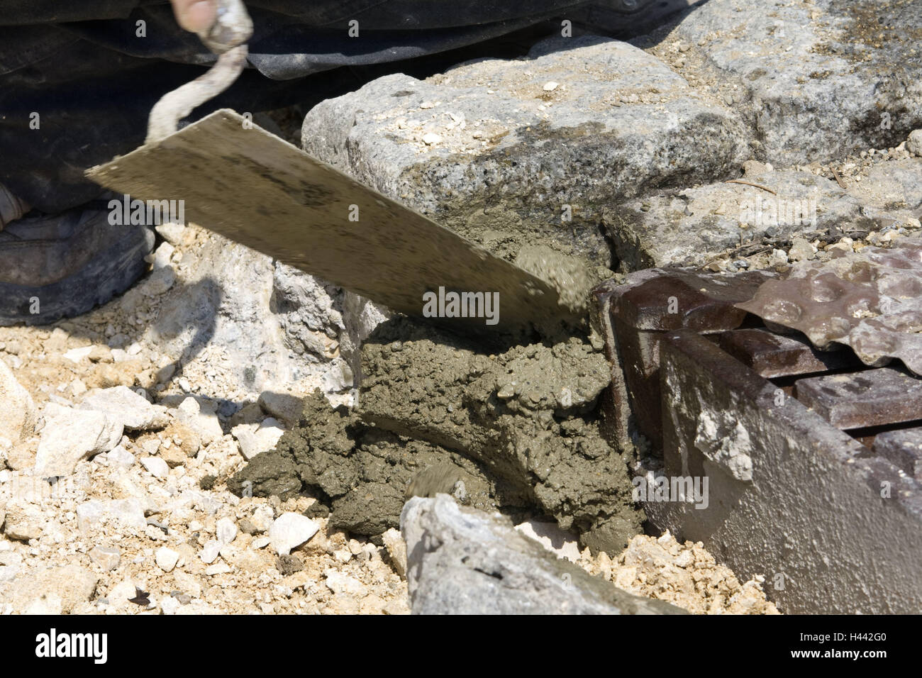 Craftsmen, tennis racket, mortar, paving-stones, lay, medium close-up ...