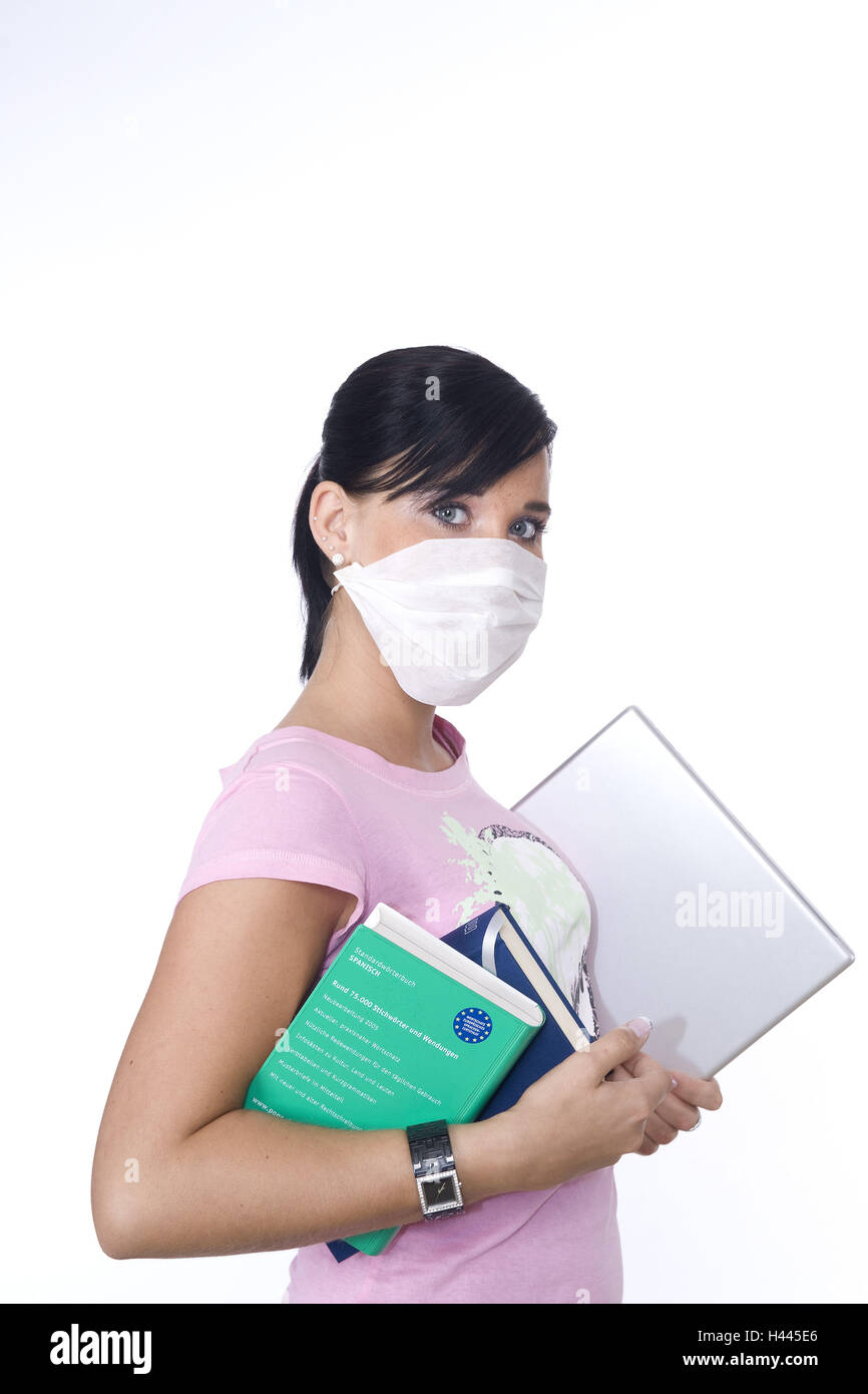 Woman, young, mask, laptop, books Stock Photo - Alamy