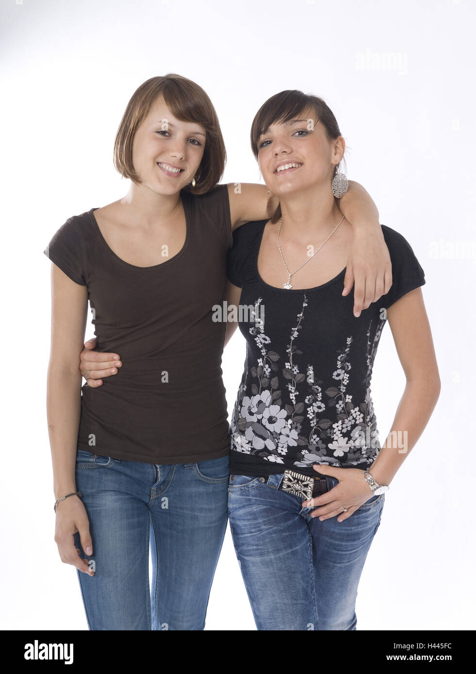 two girls, arm in arm, view camera Stock Photo - Alamy