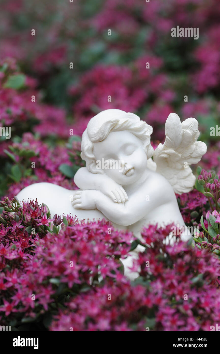 Porcelain angel in flower shrub Stock Photo - Alamy
