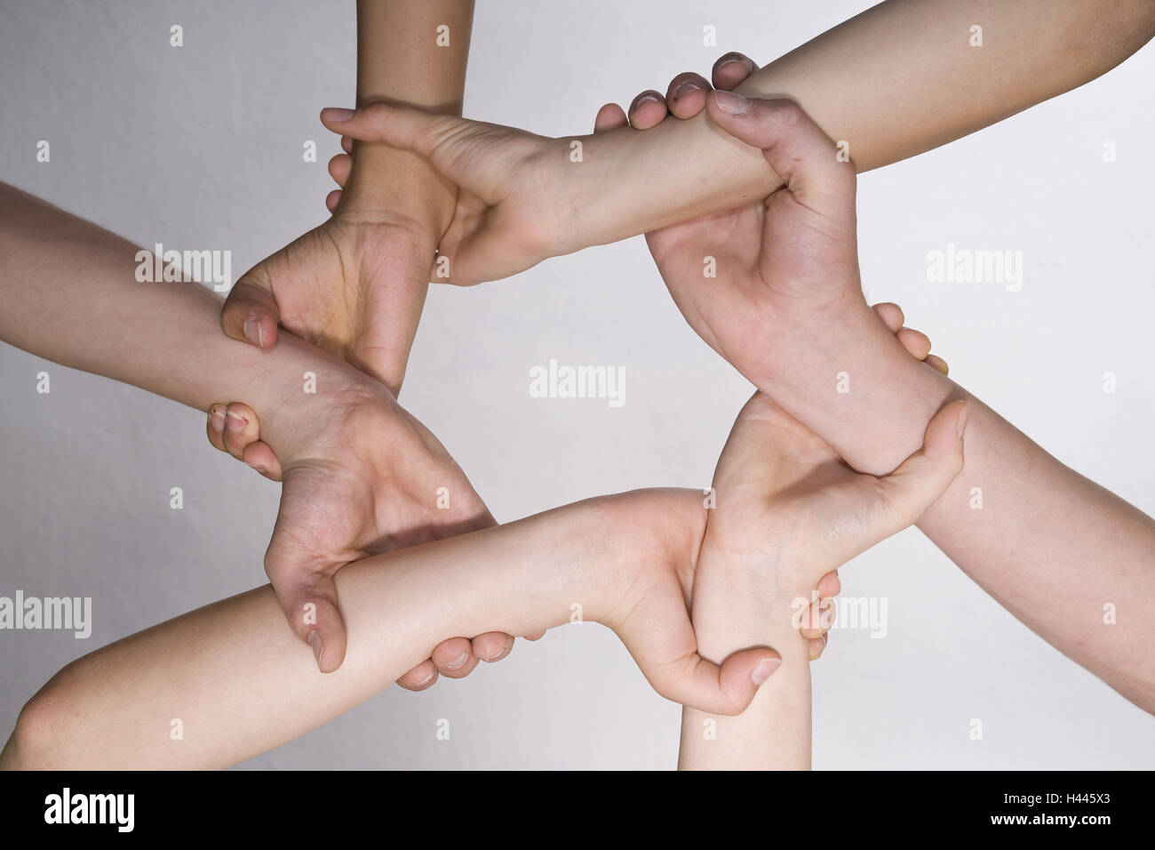 six hands, wrists, reach, hold, circle Stock Photo - Alamy