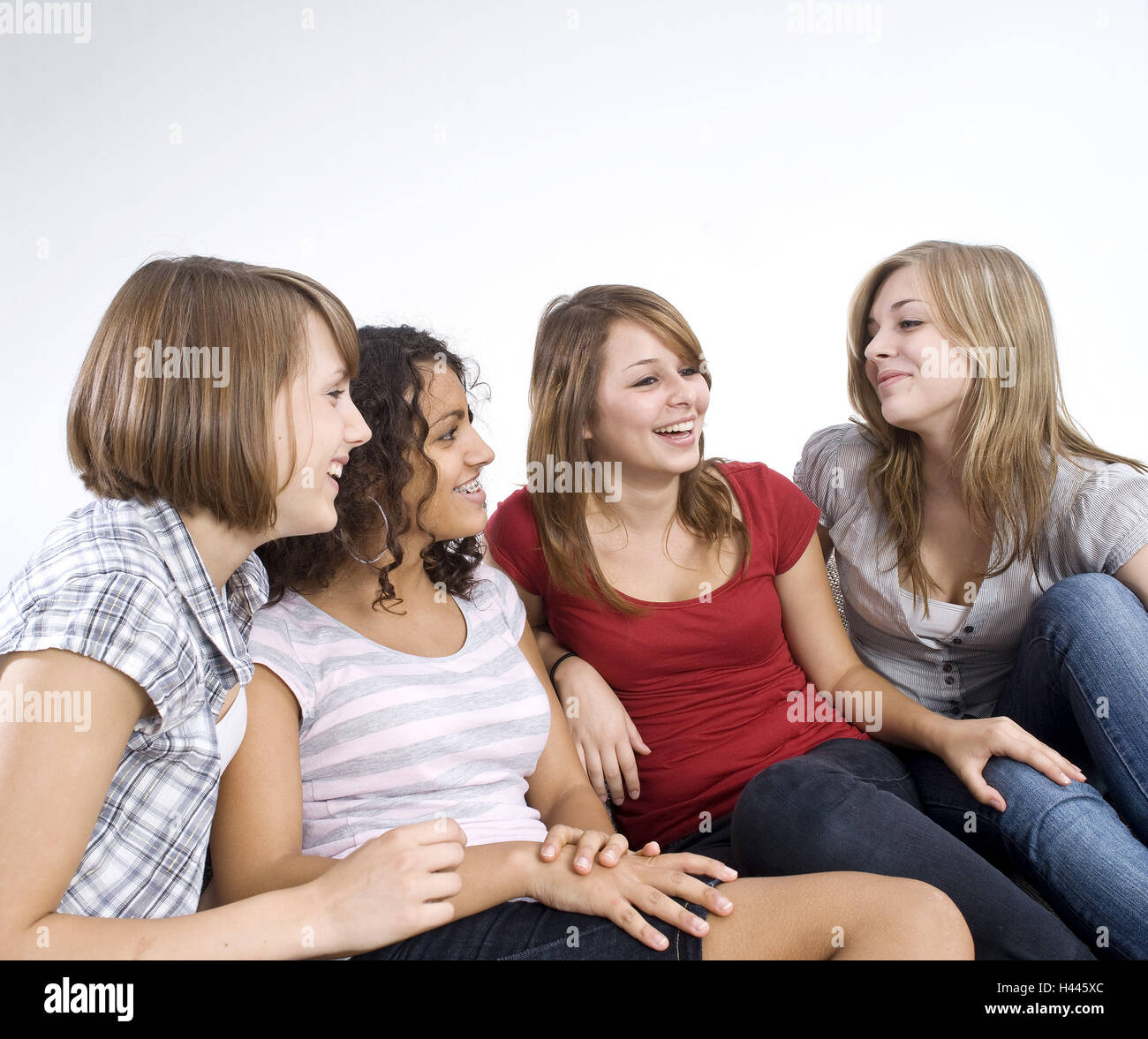 four young women, sofa, sit, maintain, laugh Stock Photo - Alamy