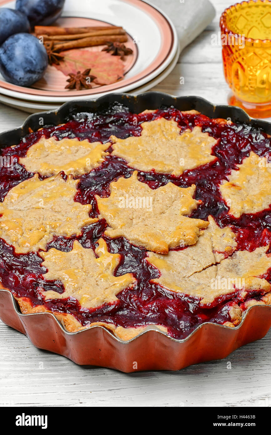 Harvest pie with autumn plums with autumn style Stock Photo - Alamy