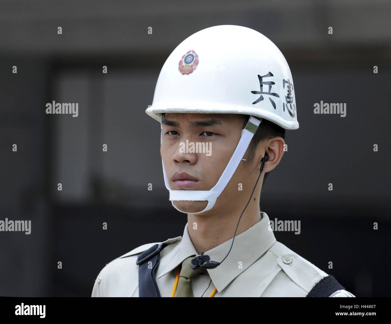 Man, young, uniform, helmet, portrait, Taipeh, Taiwan Stock Photo - Alamy