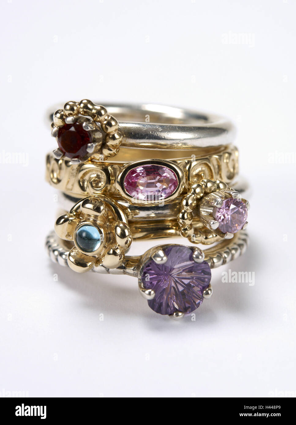 Rings, gold, silver, colourful gemstones, one above the other Stock ...