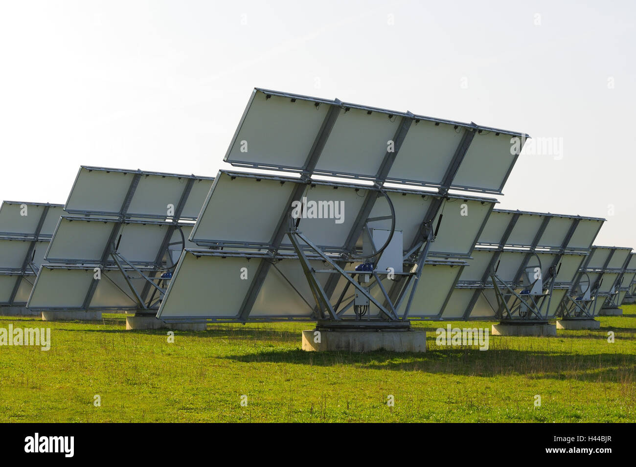 Meadow, solar collectors, solar cells, back view Stock Photo - Alamy