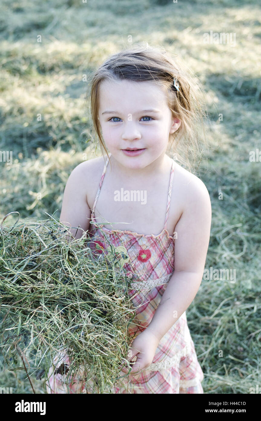 Girls, hay, play, half portrait Stock Photo - Alamy