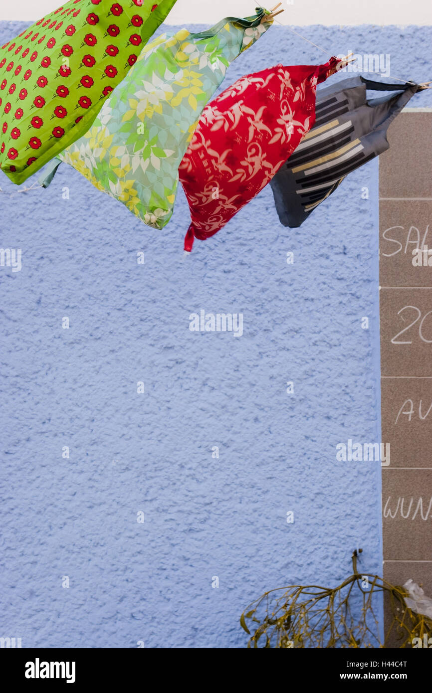 Business, facade, clothesline, purchasing bag, brightly Stock Photo - Alamy