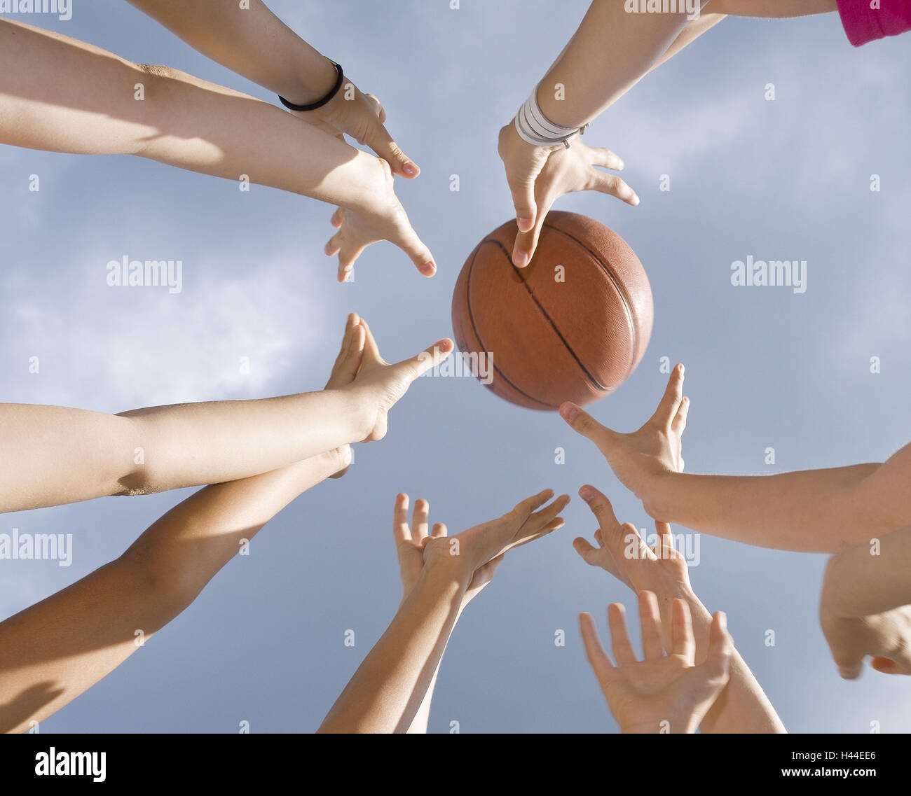 Hands, six people, basketball, trap Stock Photo - Alamy