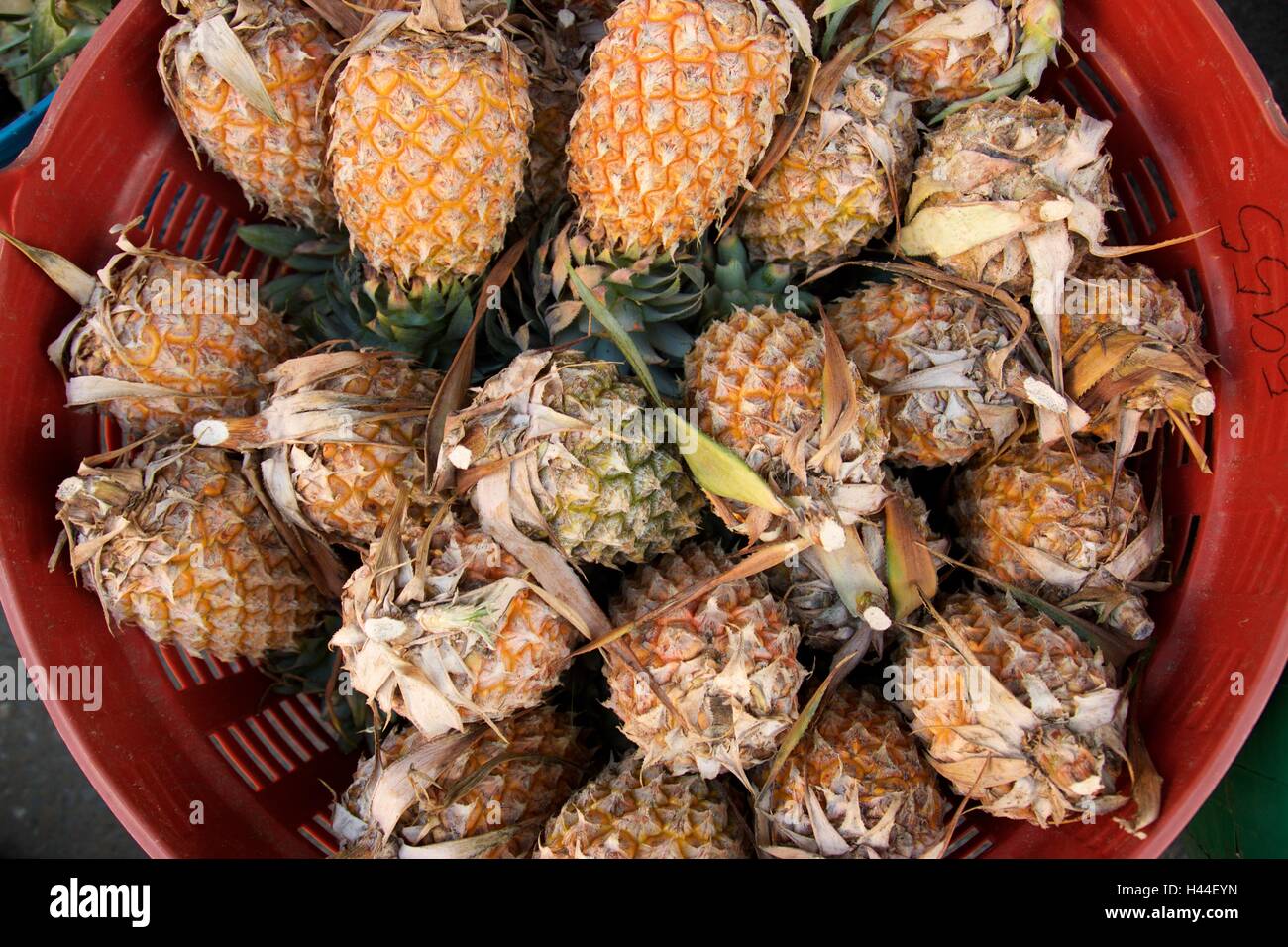 Set of many pineapples on basket Stock Photo - Alamy