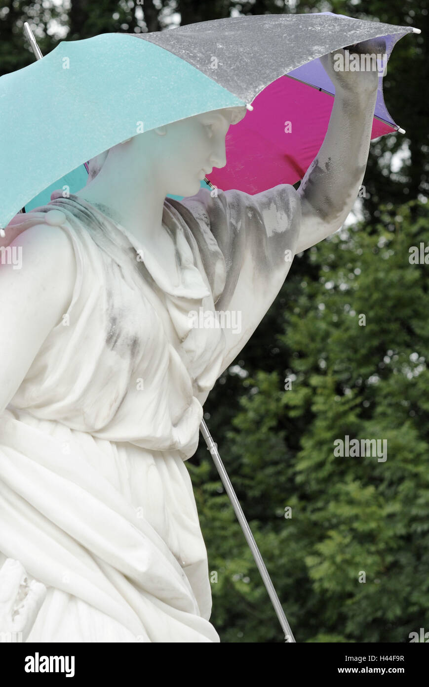 Statue, woman, umbrella Stock Photo - Alamy
