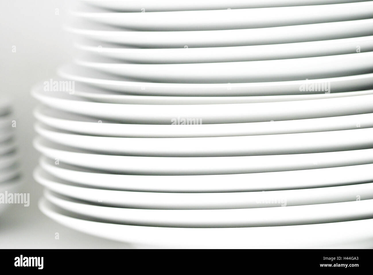 Plate, white, stacked, detail Stock Photo - Alamy