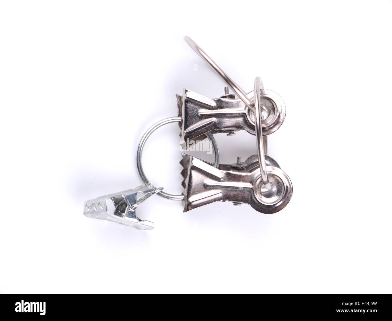 Metal fasteners for curtains on a white background Stock Photo - Alamy