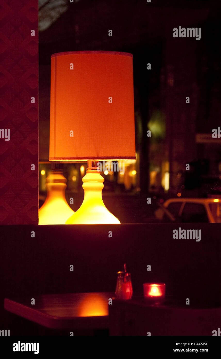 Restaurant, table, candle light, standard lamp Stock Photo - Alamy