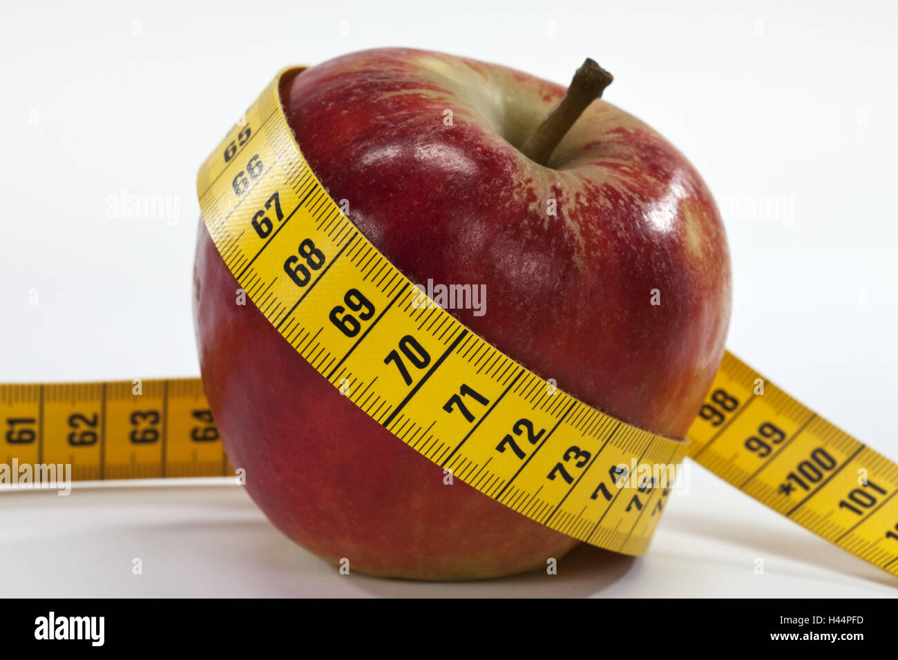 Apple, tape measure Stock Photo - Alamy