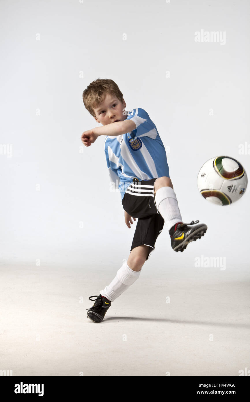 Boy, football, play, motion Stock Photo - Alamy