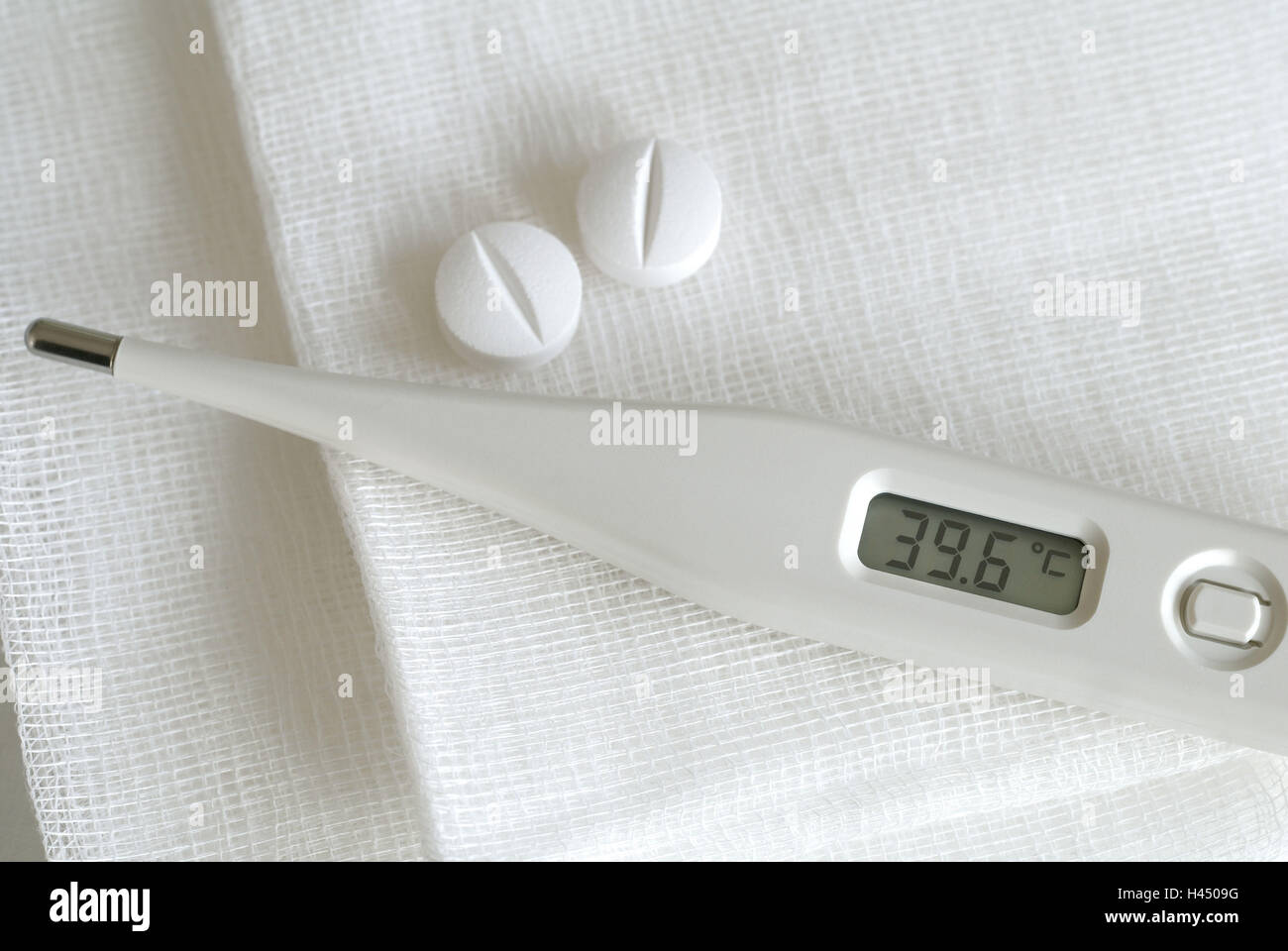 Clinical thermometer 39.6 degrees, detail, tablets Stock Photo - Alamy
